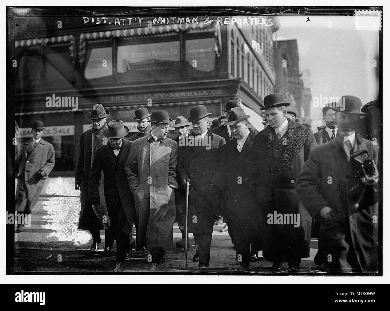 A photograph featuring District Attorney Whitman with a group of ...