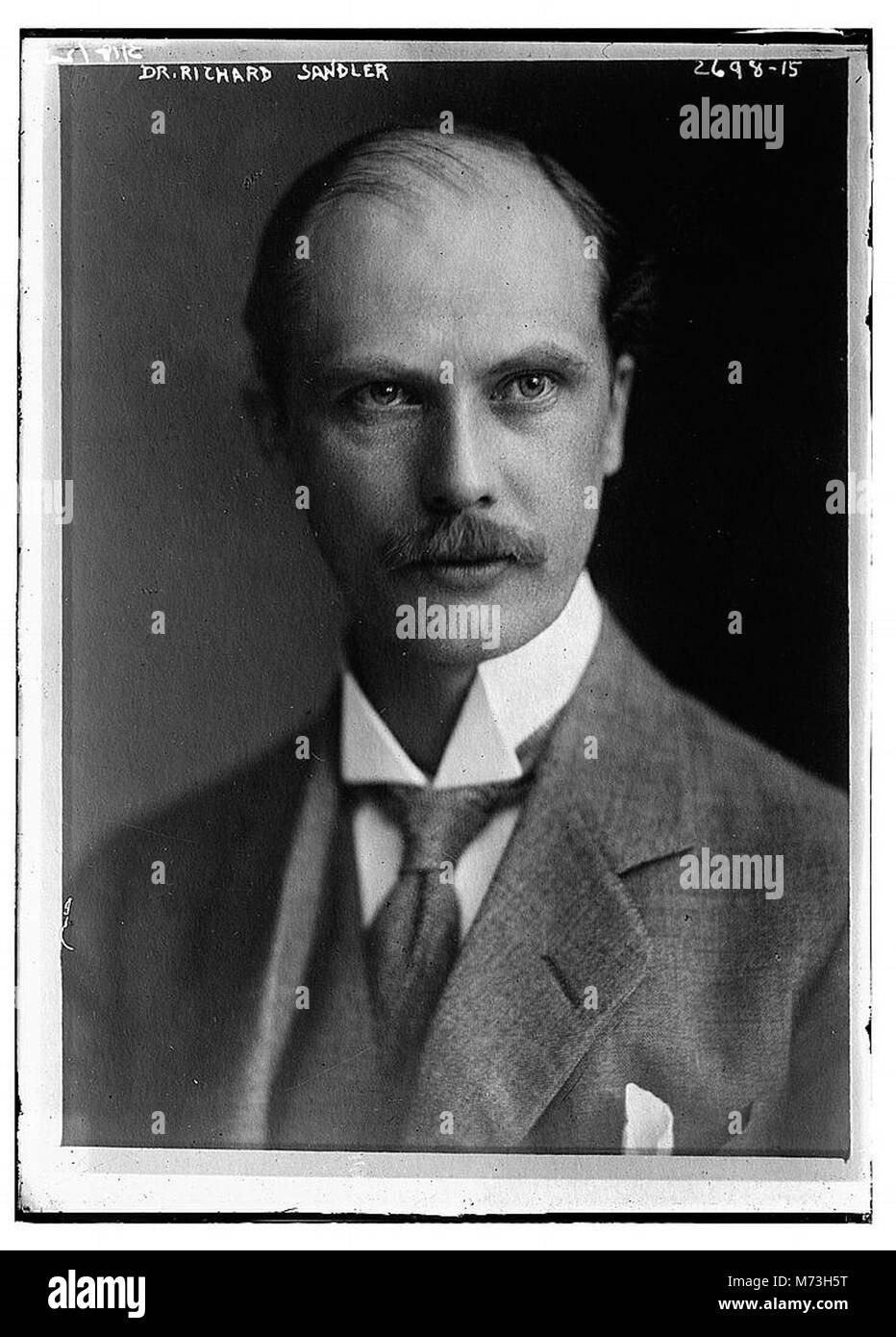 A professional portrait of Dr. Richard Sandler, showcasing his ...