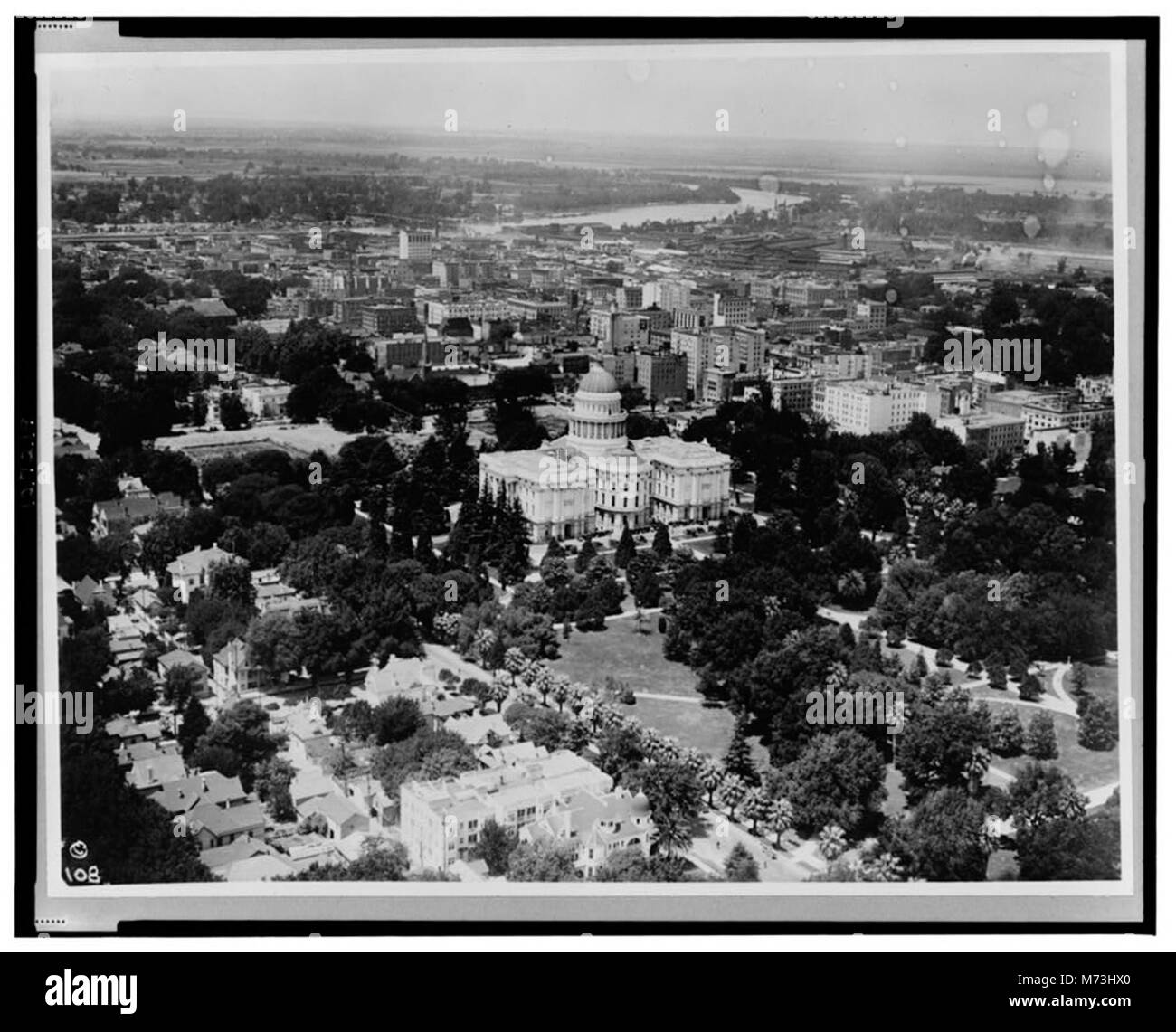 This aerial image showcases the State Capitol building, providing a ...