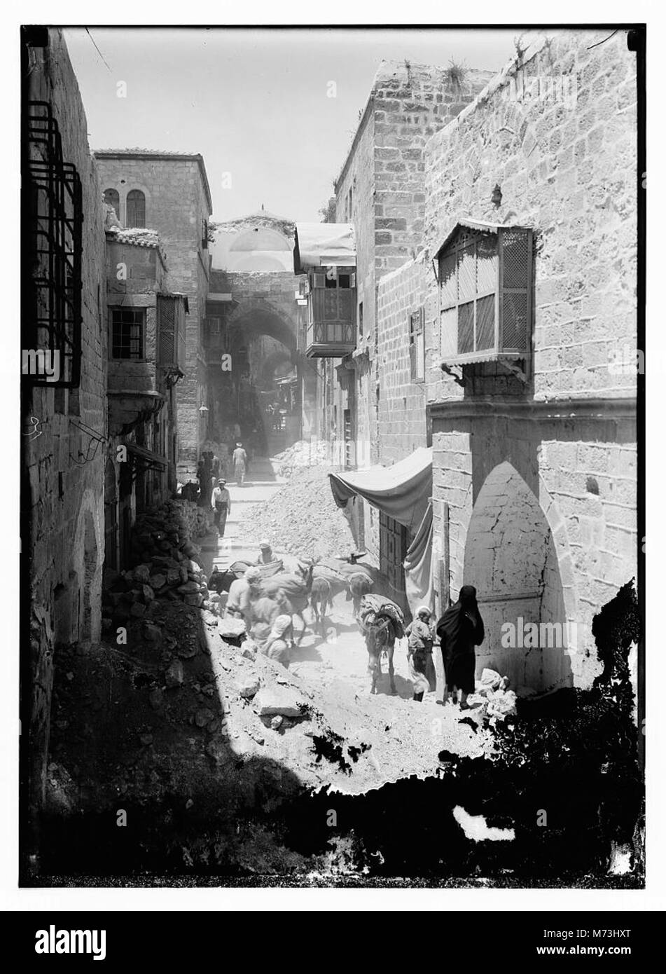The aftermath of an earthquake, with visible damage to buildings and ...