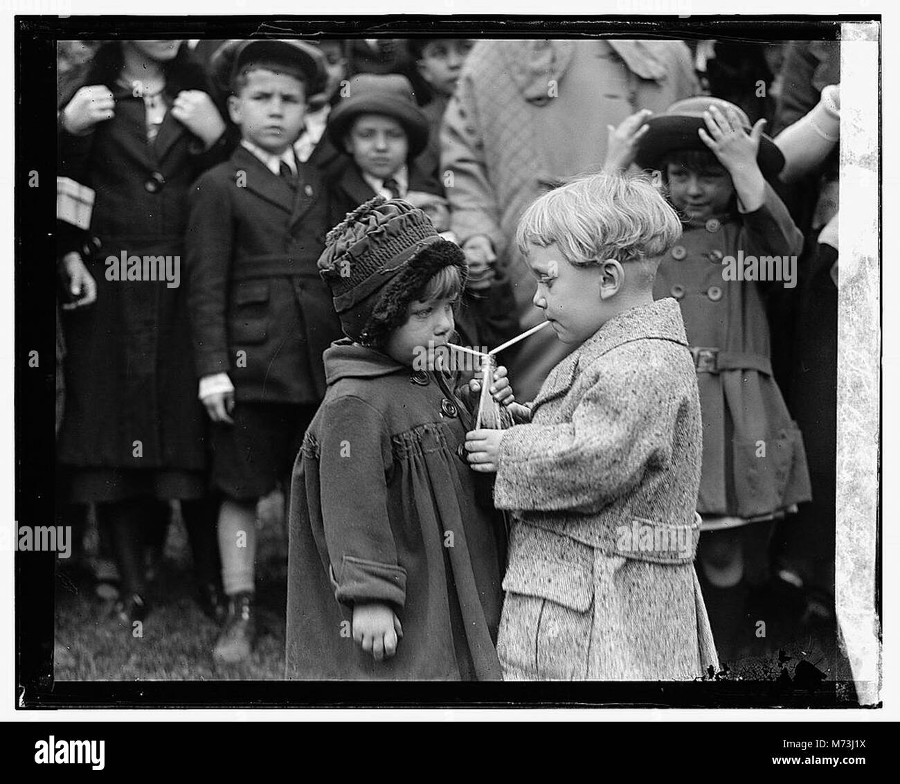A photograph capturing children participating in Easter egg rolling in ...
