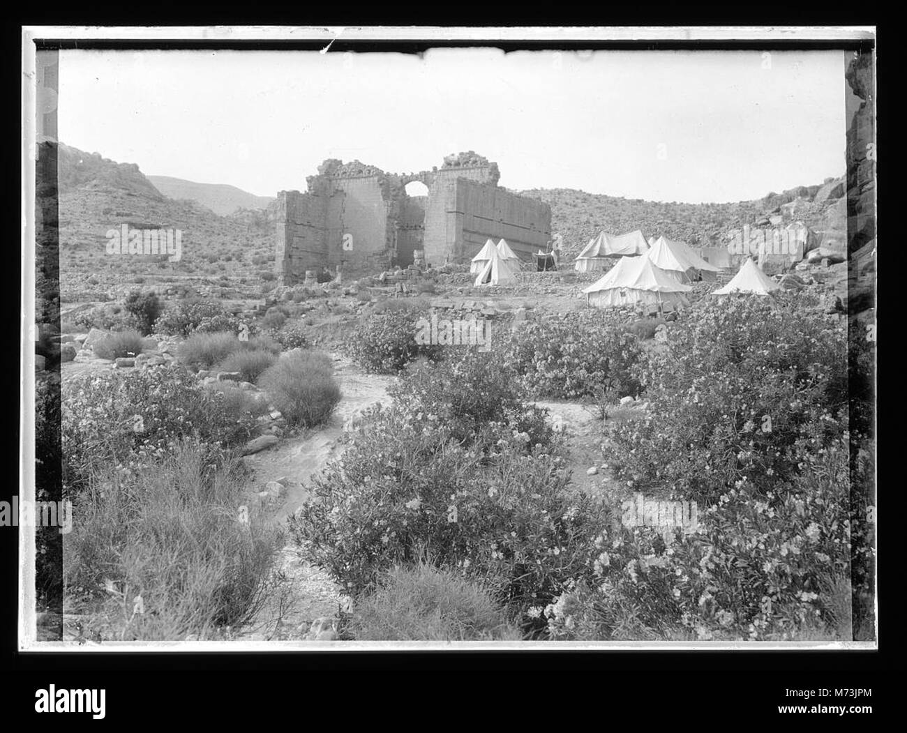 A photograph of Cook's camp at Petra, near the ruins of the Roman ...
