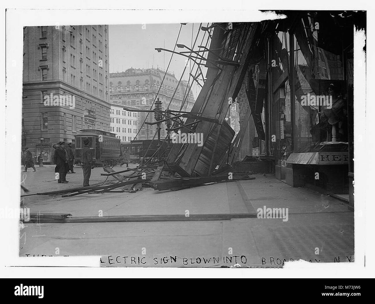 A photograph capturing the aftermath of an electrical sign being blown ...