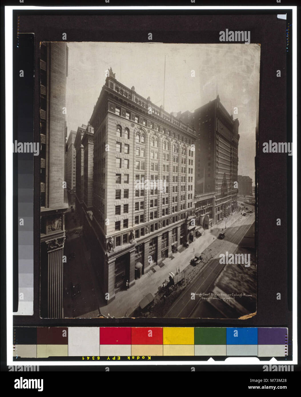 This photograph depicts the Exchange Court Building located at 52 ...