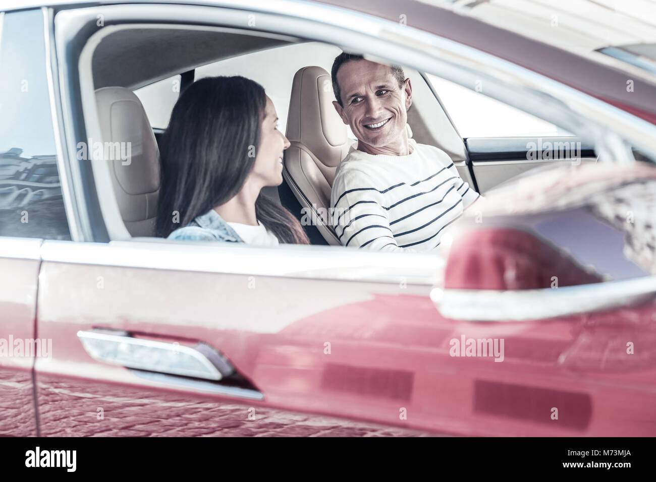 Positive pleasant people looking at each other Stock Photo - Alamy