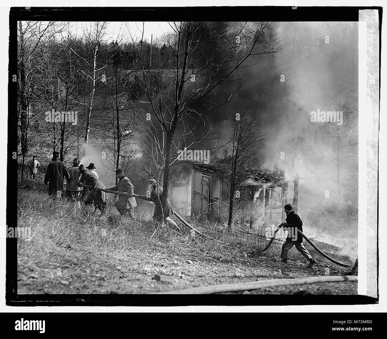 A historical photo depicting a fire at Camp Leech, an army base ...