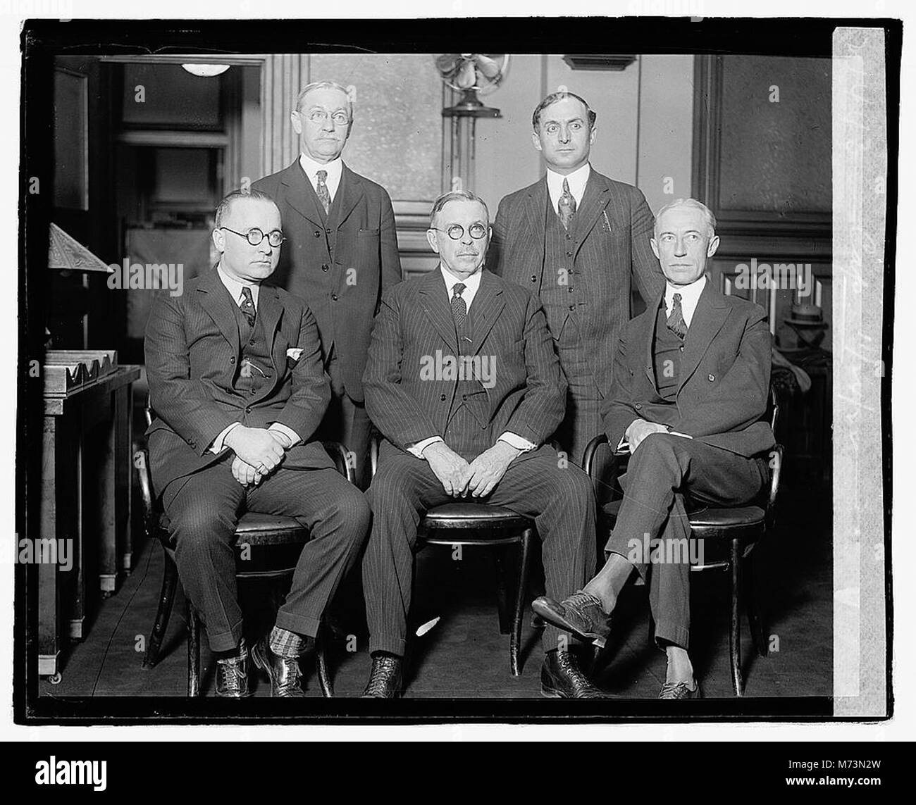 A photograph of five unidentified men taken on November 24, 1922. The ...