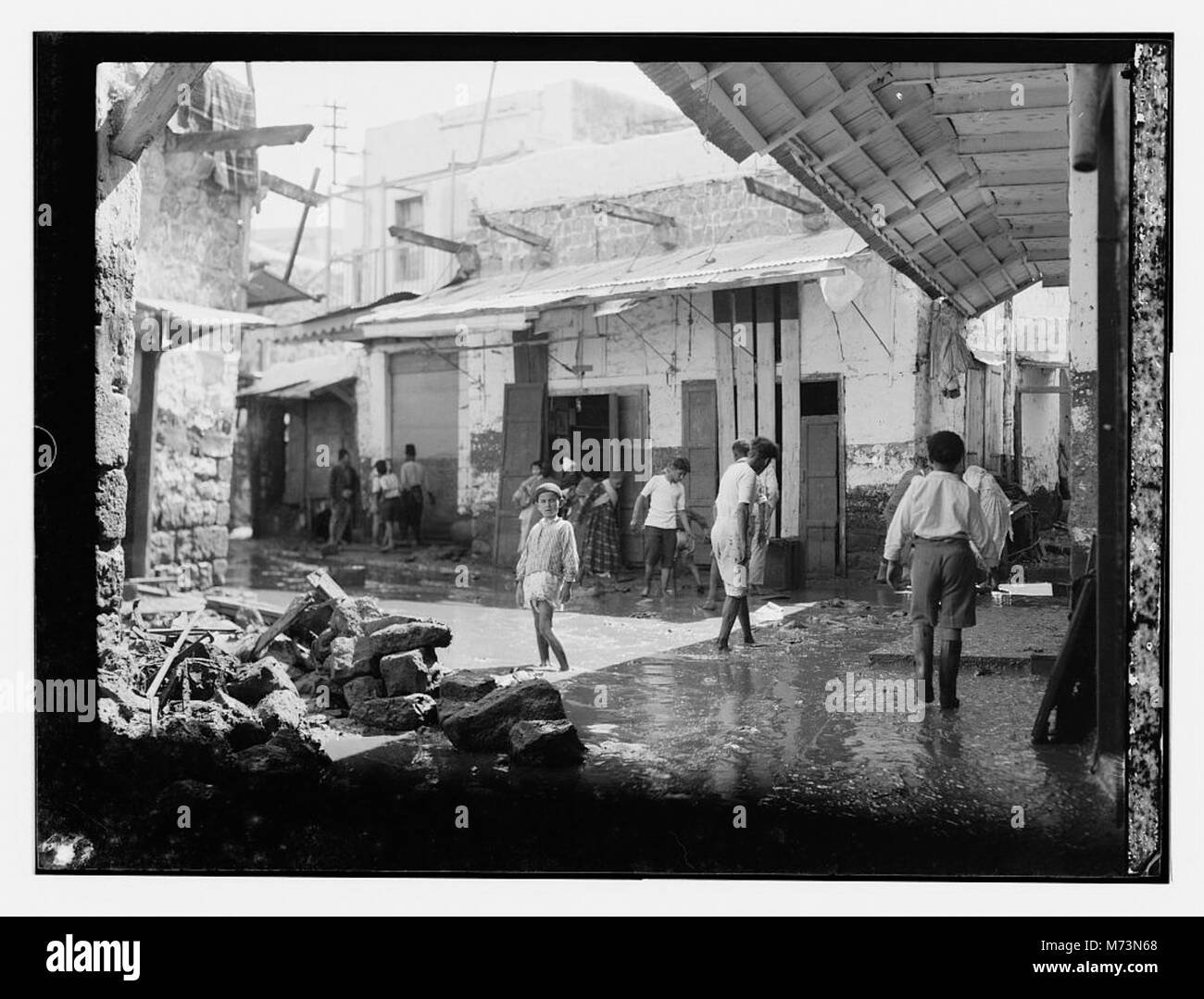 This image depicts the destruction caused by flooding and war damage ...