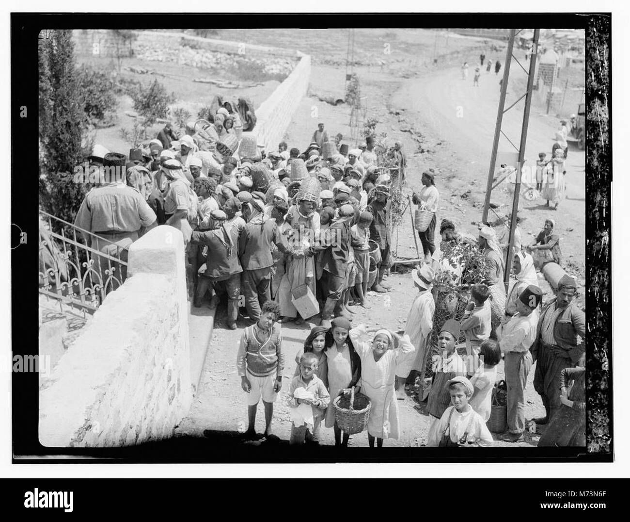 A photograph depicting the aftermath of war-induced flooding, showing ...