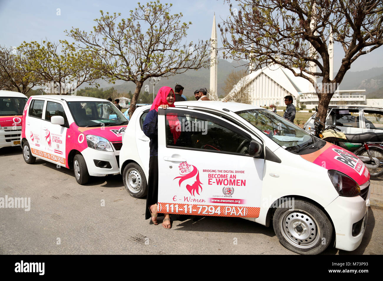 Islamabad, Pakistan. 8th Mar, 2018. A female driver poses for photos ...