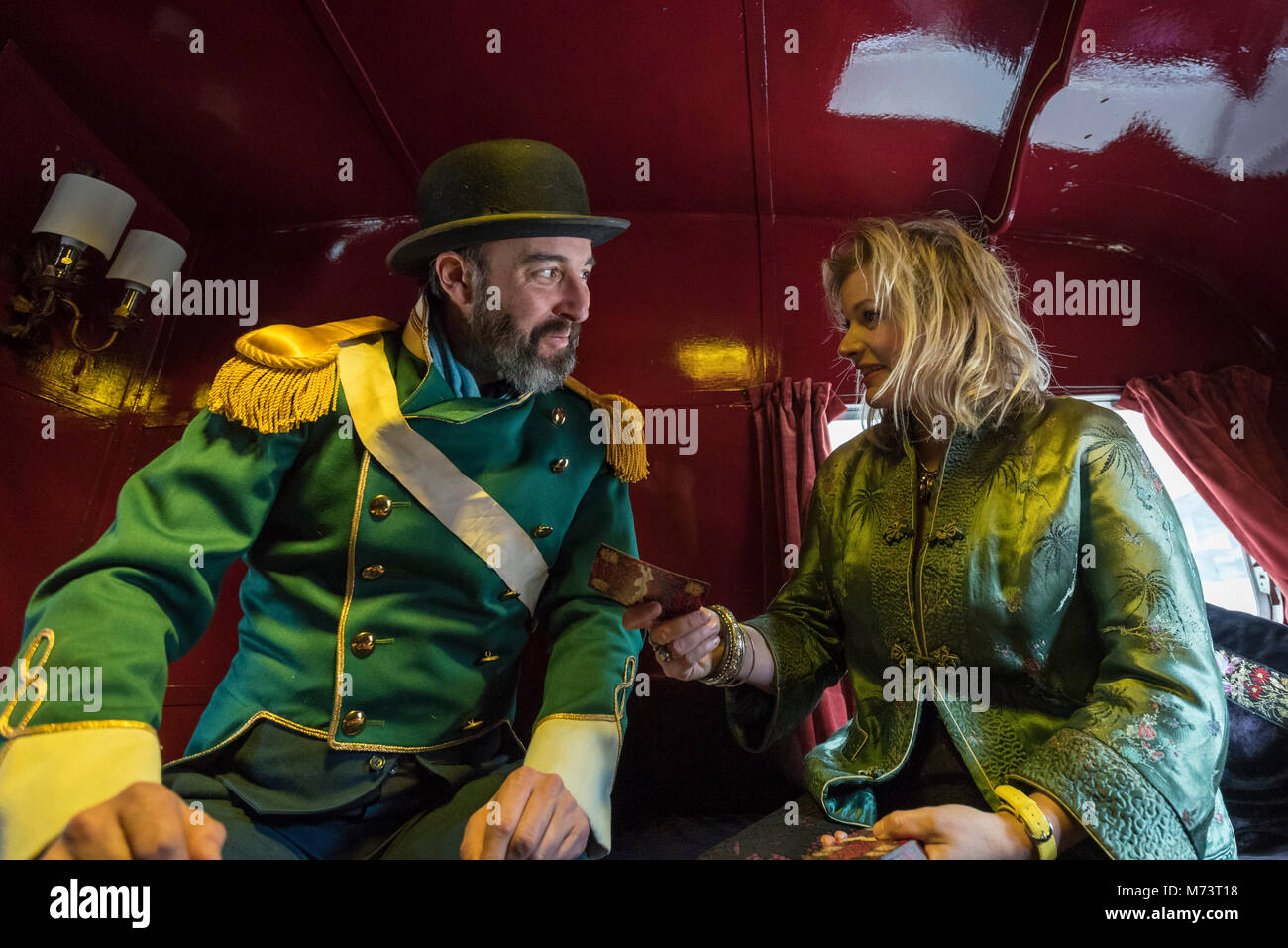 London, UK. 8 March 2018. British artist Alice Instone (R) gives a ...