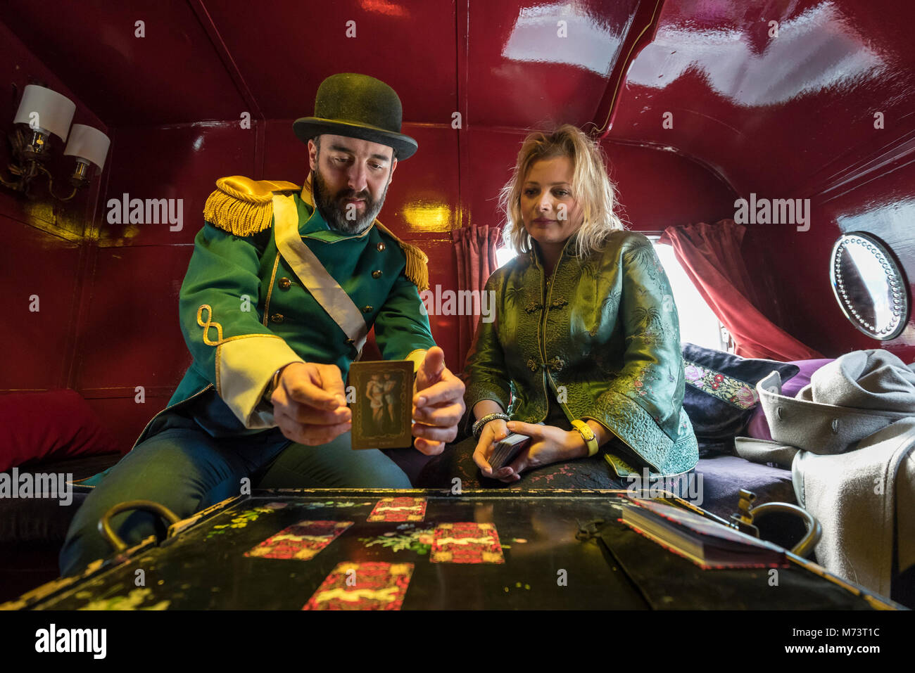 London, UK. 8 March 2018. British artist Alice Instone (R) gives a ...