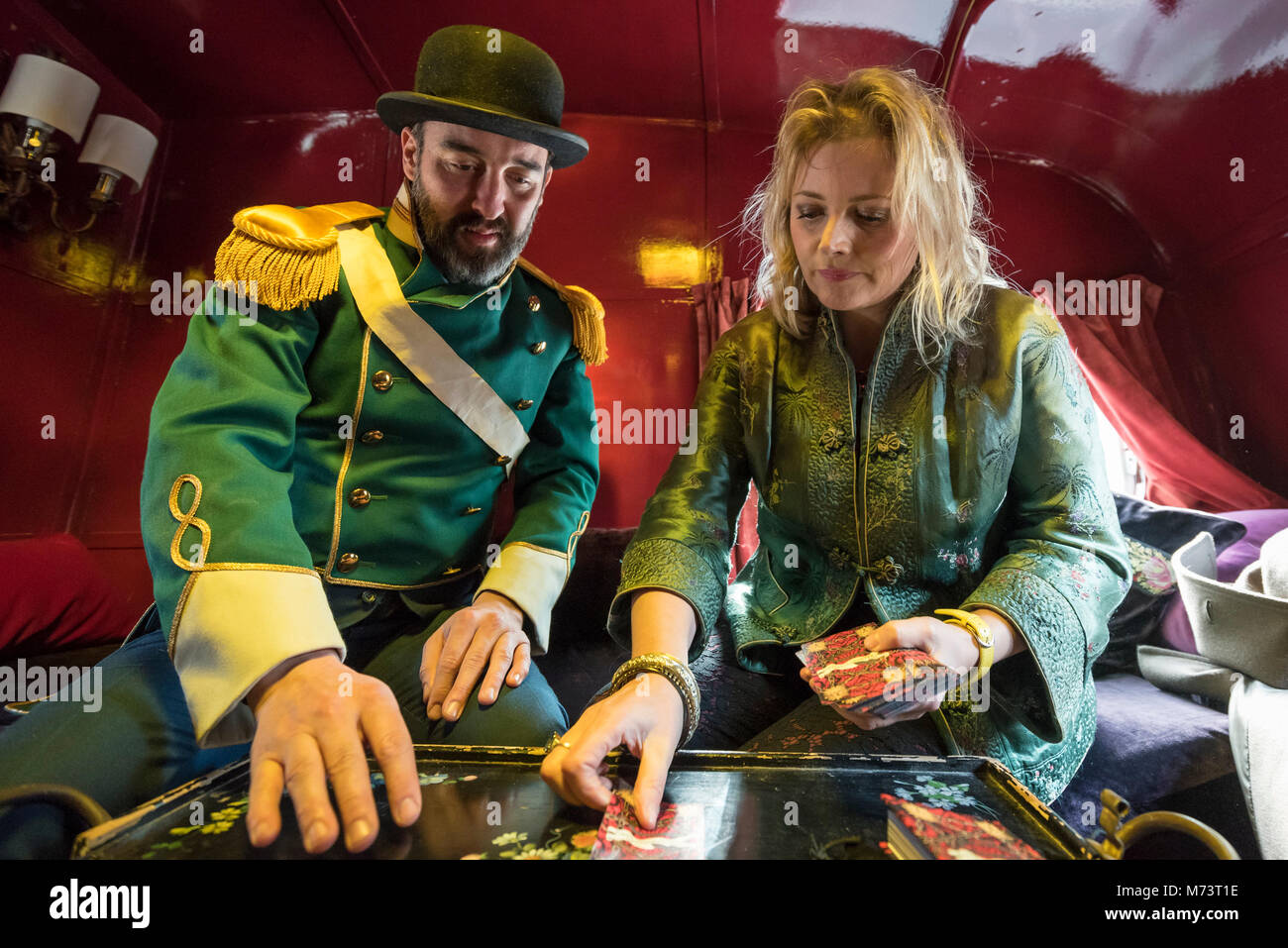 London, UK. 8 March 2018. British artist Alice Instone (R) gives a ...