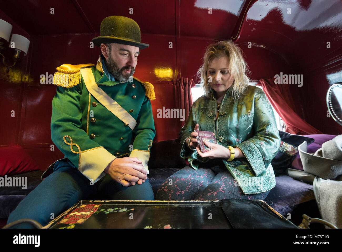 London, UK. 8 March 2018. British artist Alice Instone (R) gives a ...