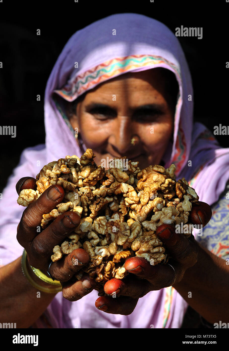 Jammu, Indian-controlled Kashmir. 8th Mar, 2018. An Indian woman works ...