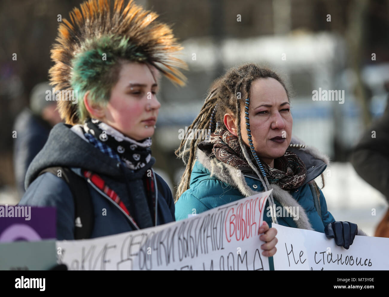 Saint Petersburg, Russia. 8th Mar, 2018. Women seen holding placards ...