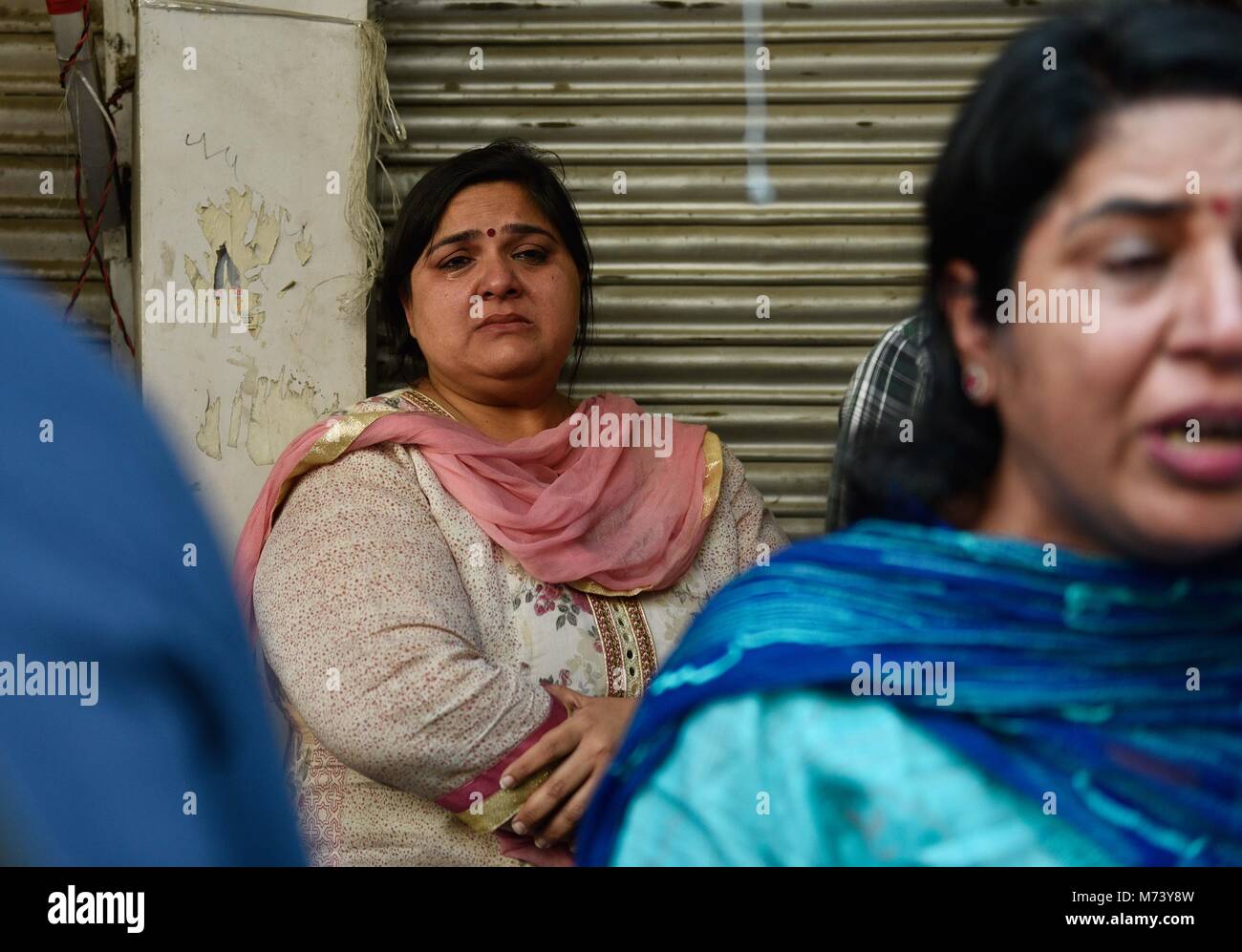 NEW DELHI, INDIA - MARCH 8: Shopowners crying after their shops got ...