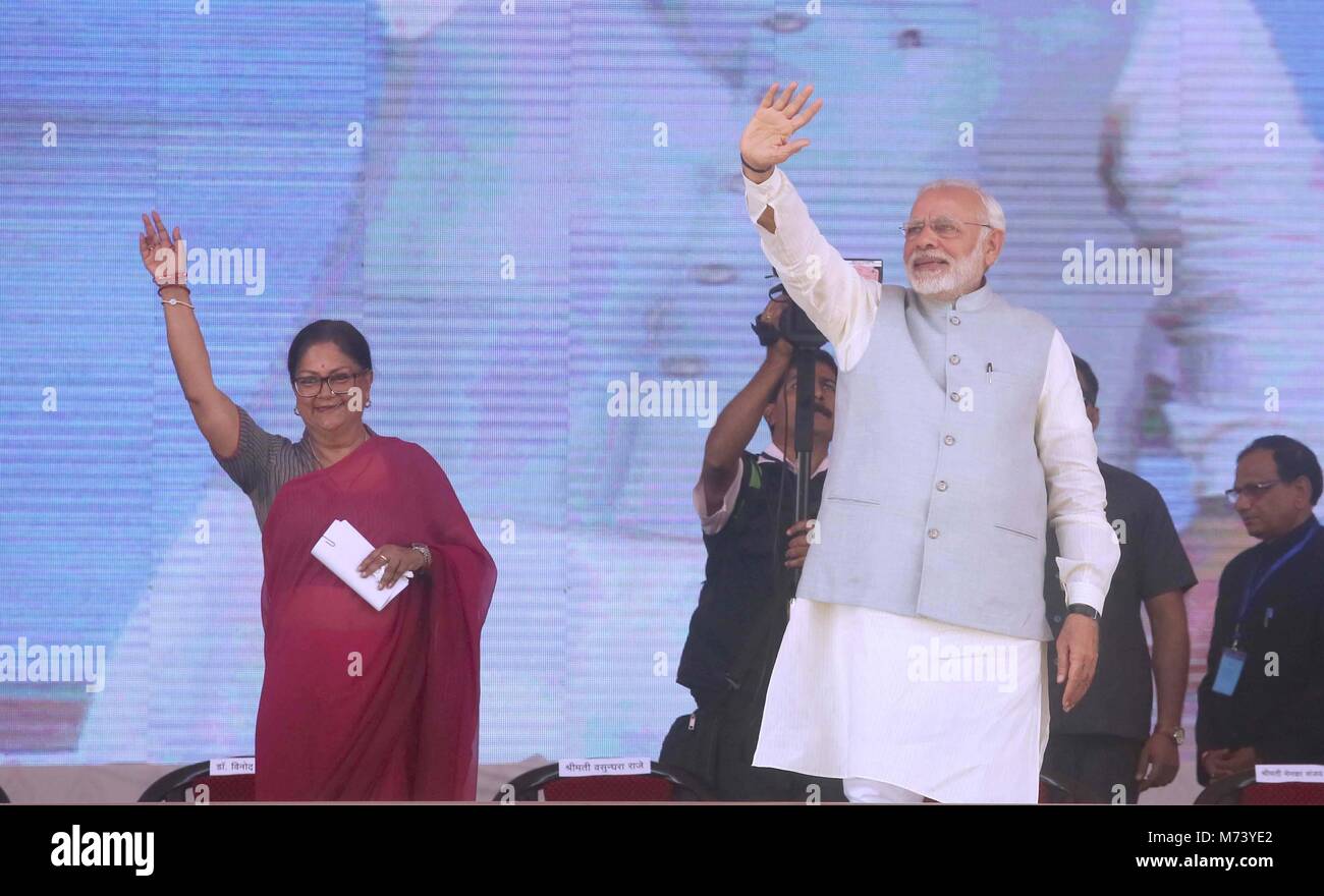 JHUNJHUNU, INDIA - MARCH 8: Prime Minister Narendra Modi (R) and ...