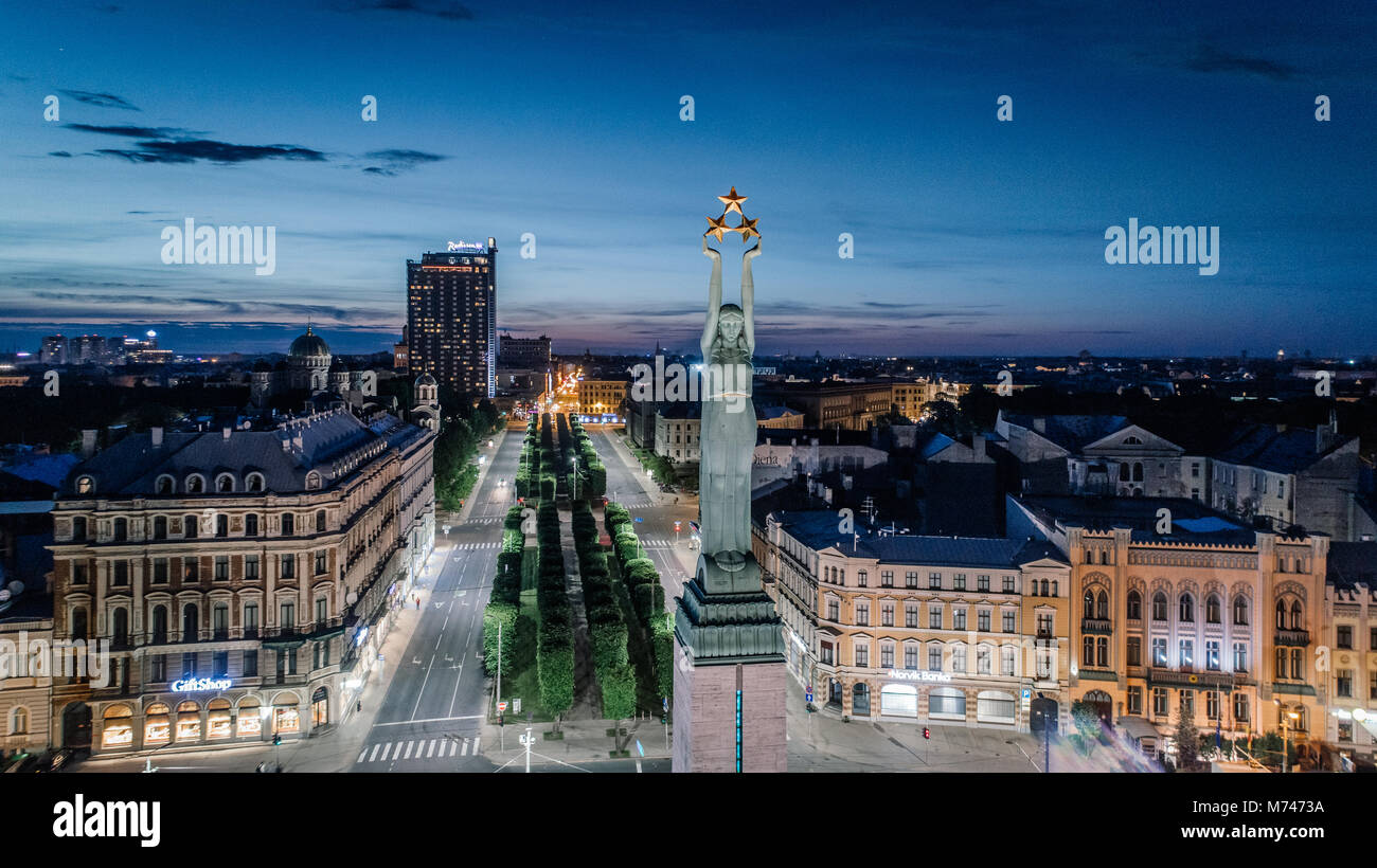Riga city Night time bridge Autumn Drone flight Milda monument Stock ...