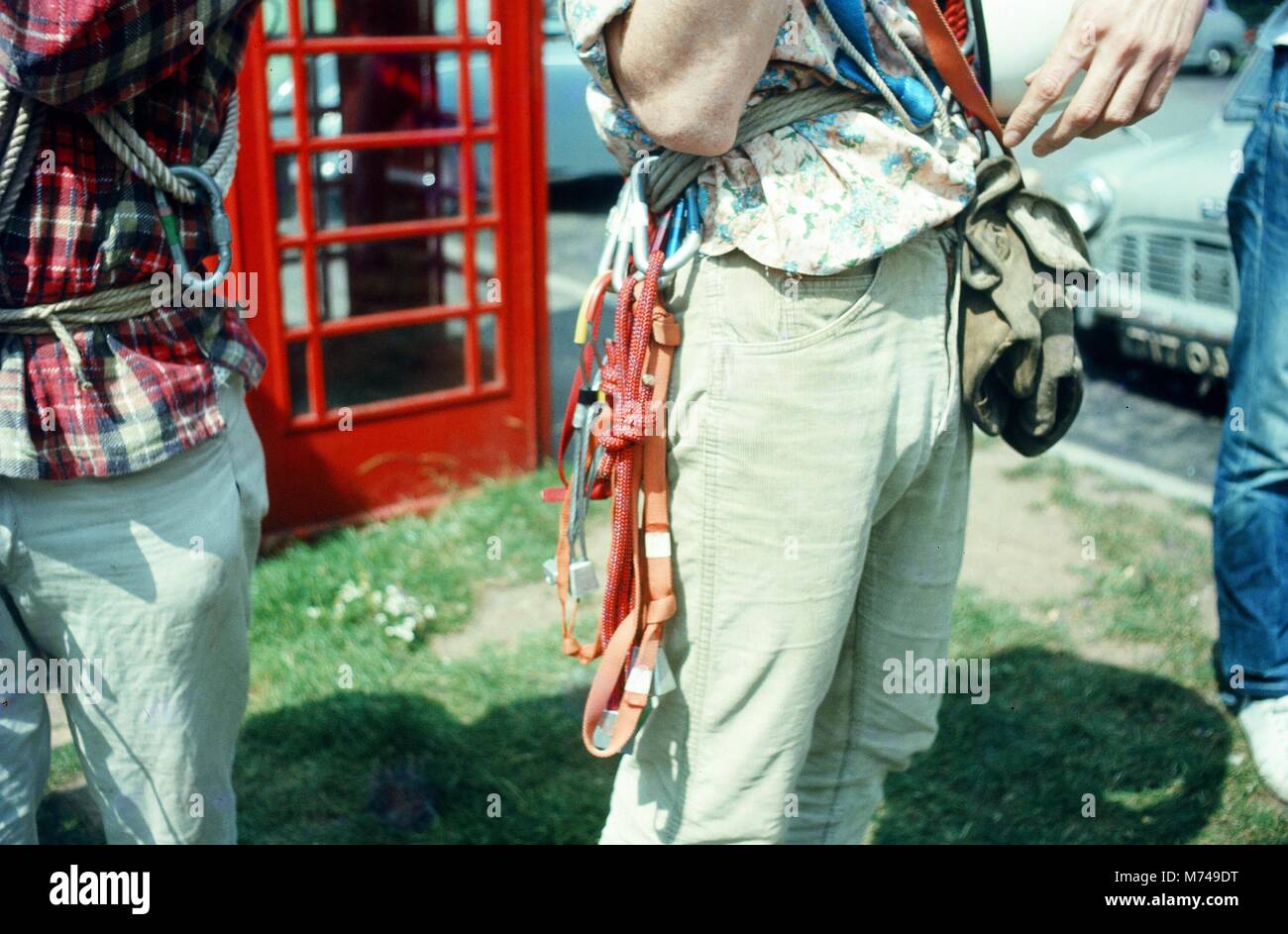 Two people have wrapped around their waists and have other ropes and ...