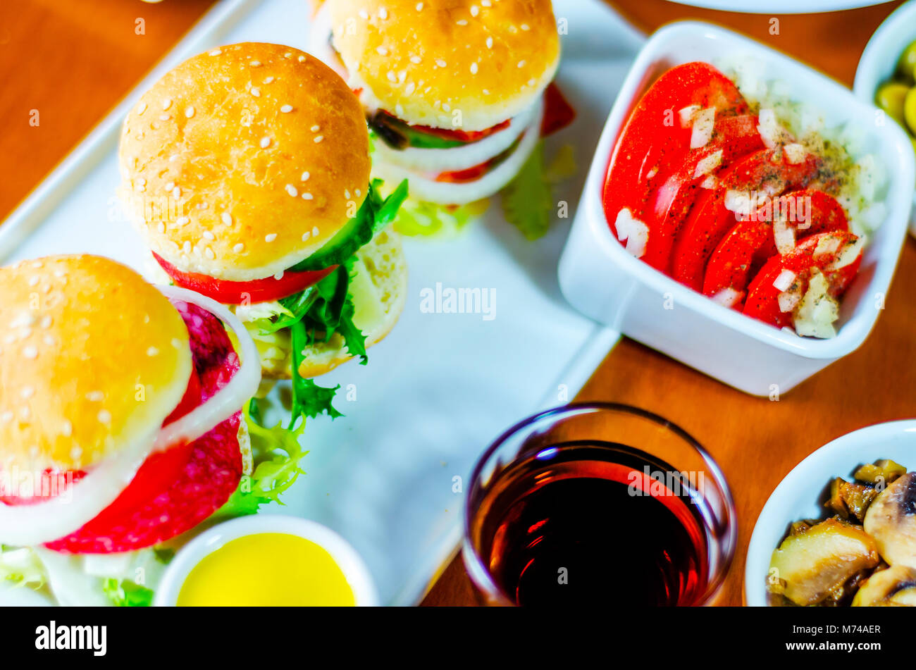 mini burgers with meat, vegetables, cheese and other toppings, bread ...