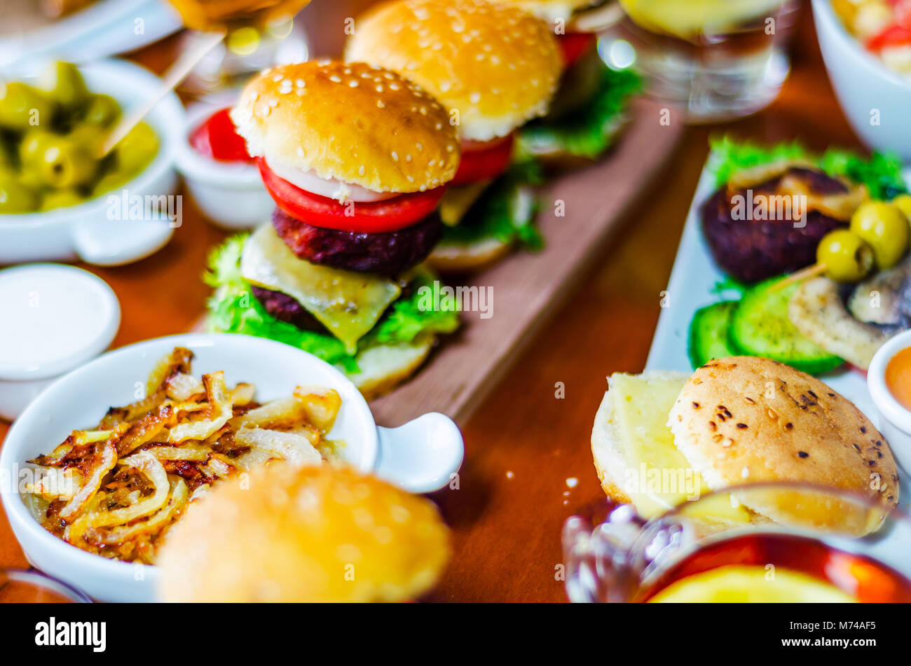 mini burgers with meat, vegetables, cheese and other toppings, bread ...
