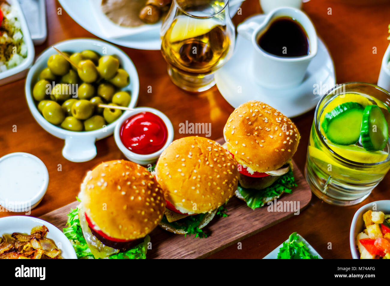 mini burgers with meat, vegetables, cheese and other toppings, bread ...