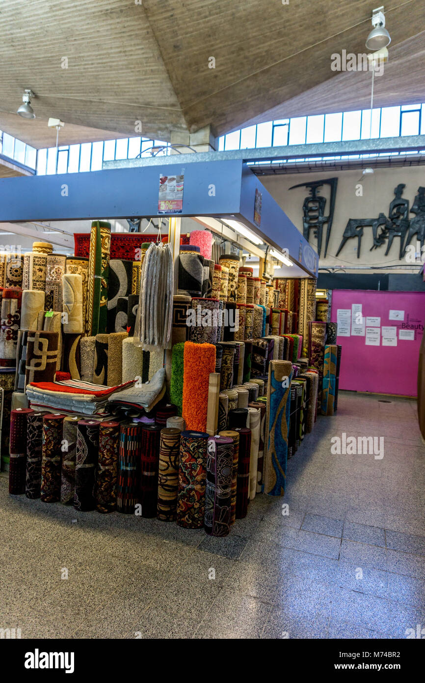 Rugs for sale at a market stall in the Queensgate Market, Huddersfield ...