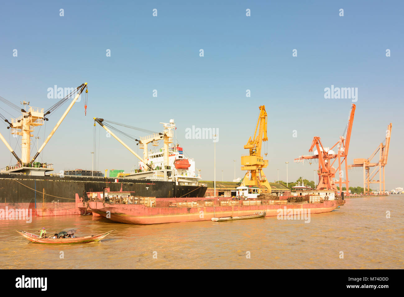 Yangon (Rangoon): Yangon River, cargo ship, port crane of Bo Aung Kyaw Terminal, , Yangon Region ...