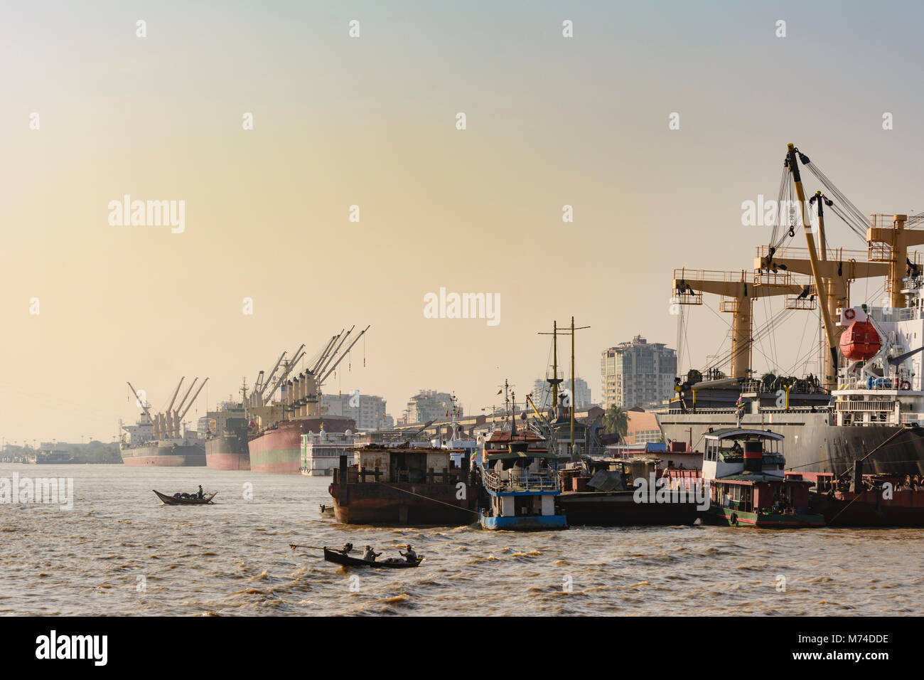 Yangon (Rangoon): Yangon River, cargo ship, port crane of Bo Aung Kyaw ...