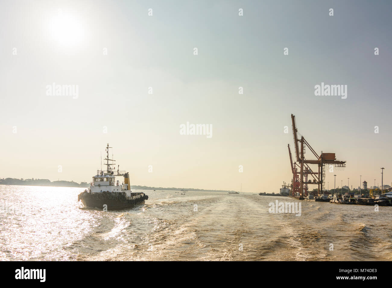 Yangon (Rangoon): Yangon River, tug boat, port crane of Bo Aung Kyaw ...