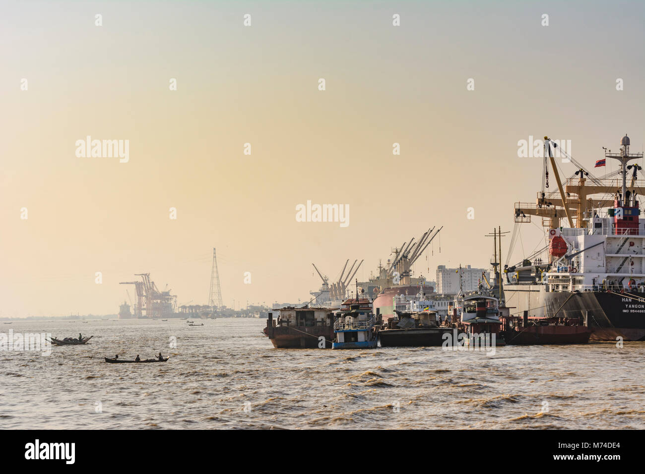 Yangon (Rangoon): Yangon River, cargo ship, port crane of Bo Aung Kyaw ...
