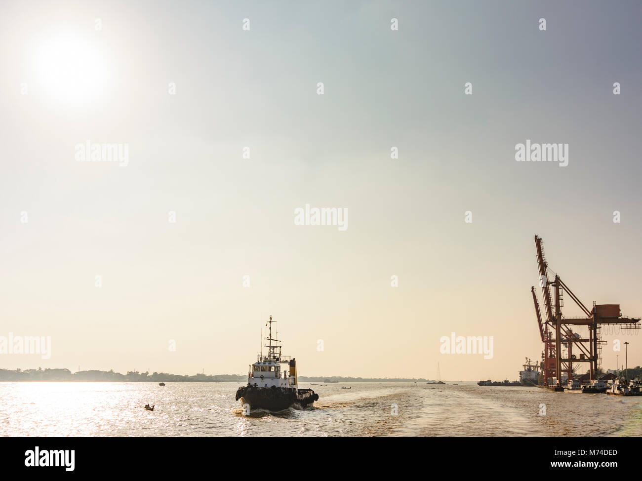 Yangon (Rangoon): Yangon River, tug boat, port crane of Bo Aung Kyaw ...