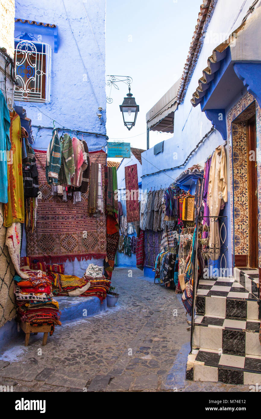 Rugs mats carpets and traditional style clothes on sale on display in ...