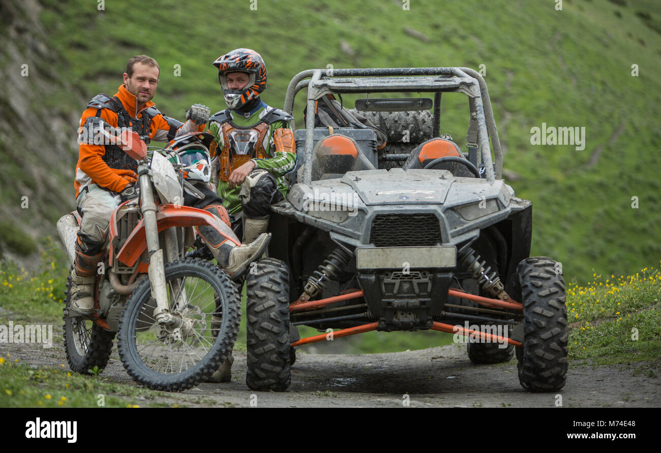 Enduro and buggy offorad drivers in Georgia with helmet Stock Photo - Alamy