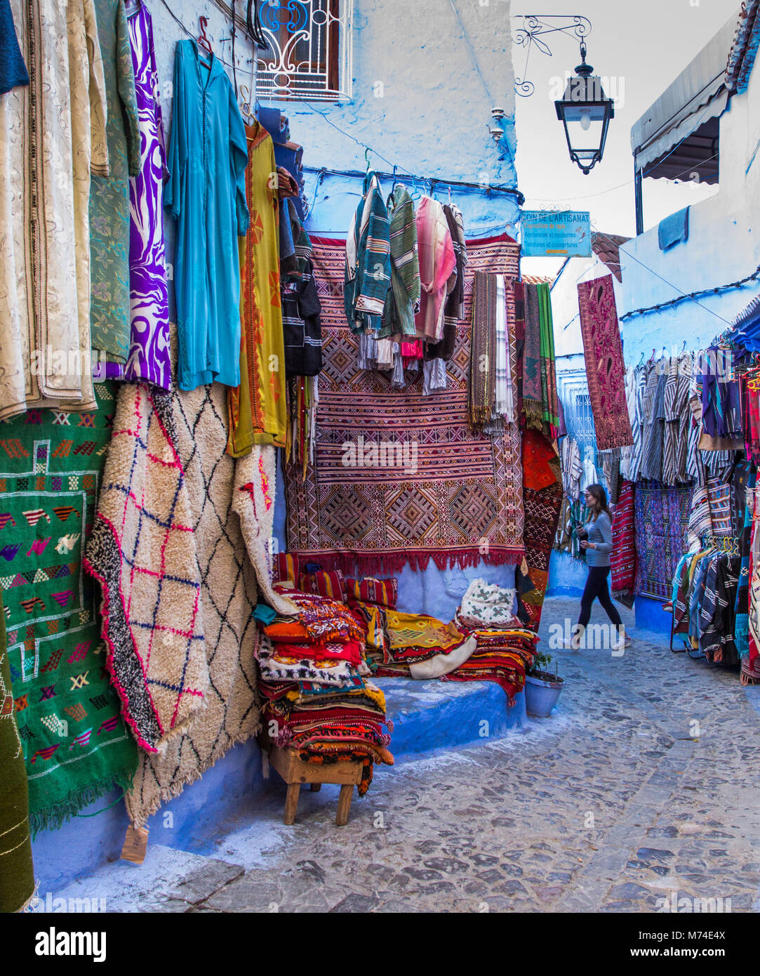 Rugs mats carpets and traditional style clothes on sale on display in ...