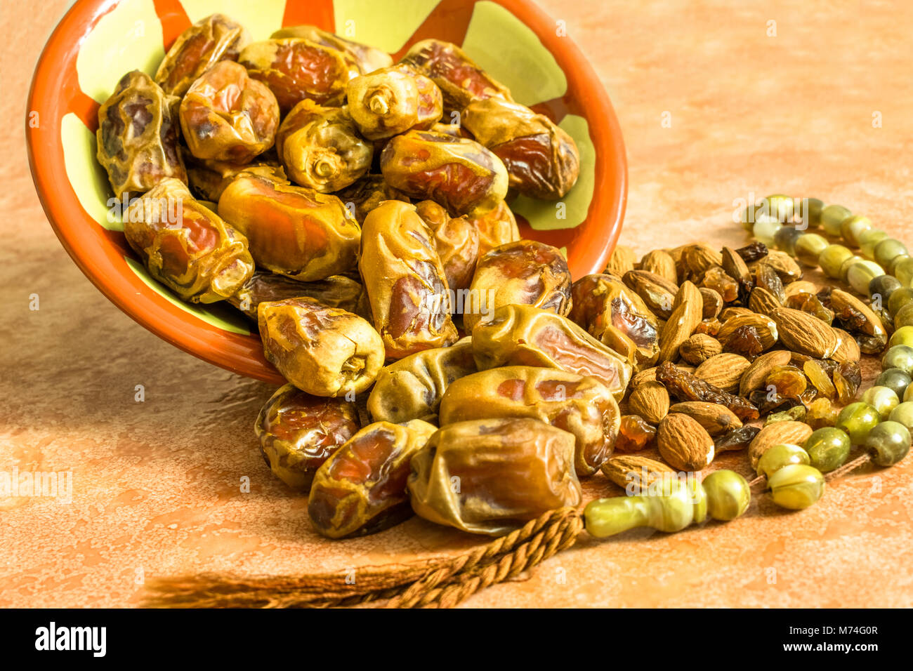 lots of fresh and healthy dates kept in a Arabian traditional pot and ...