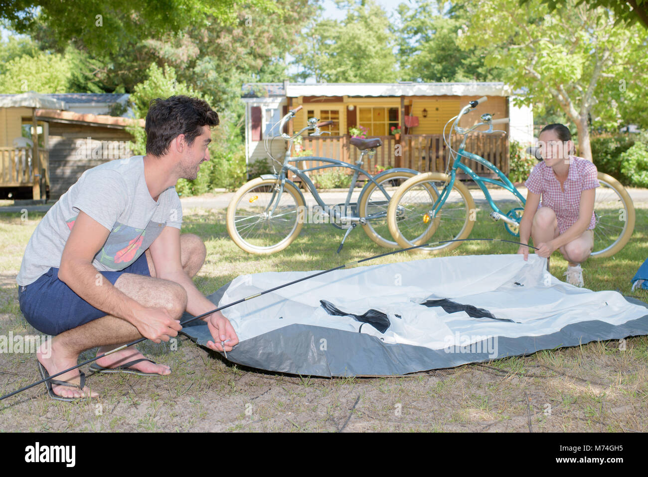 Camping help couple tent hi-res stock photography and images - Alamy