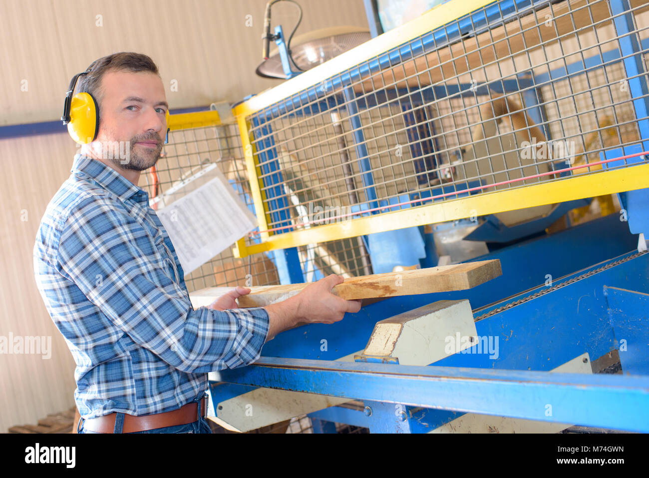 Sawmill employee working wood hi-res stock photography and images - Alamy