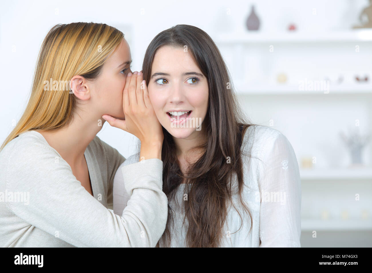 Telling secrets hi-res stock photography and images - Alamy
