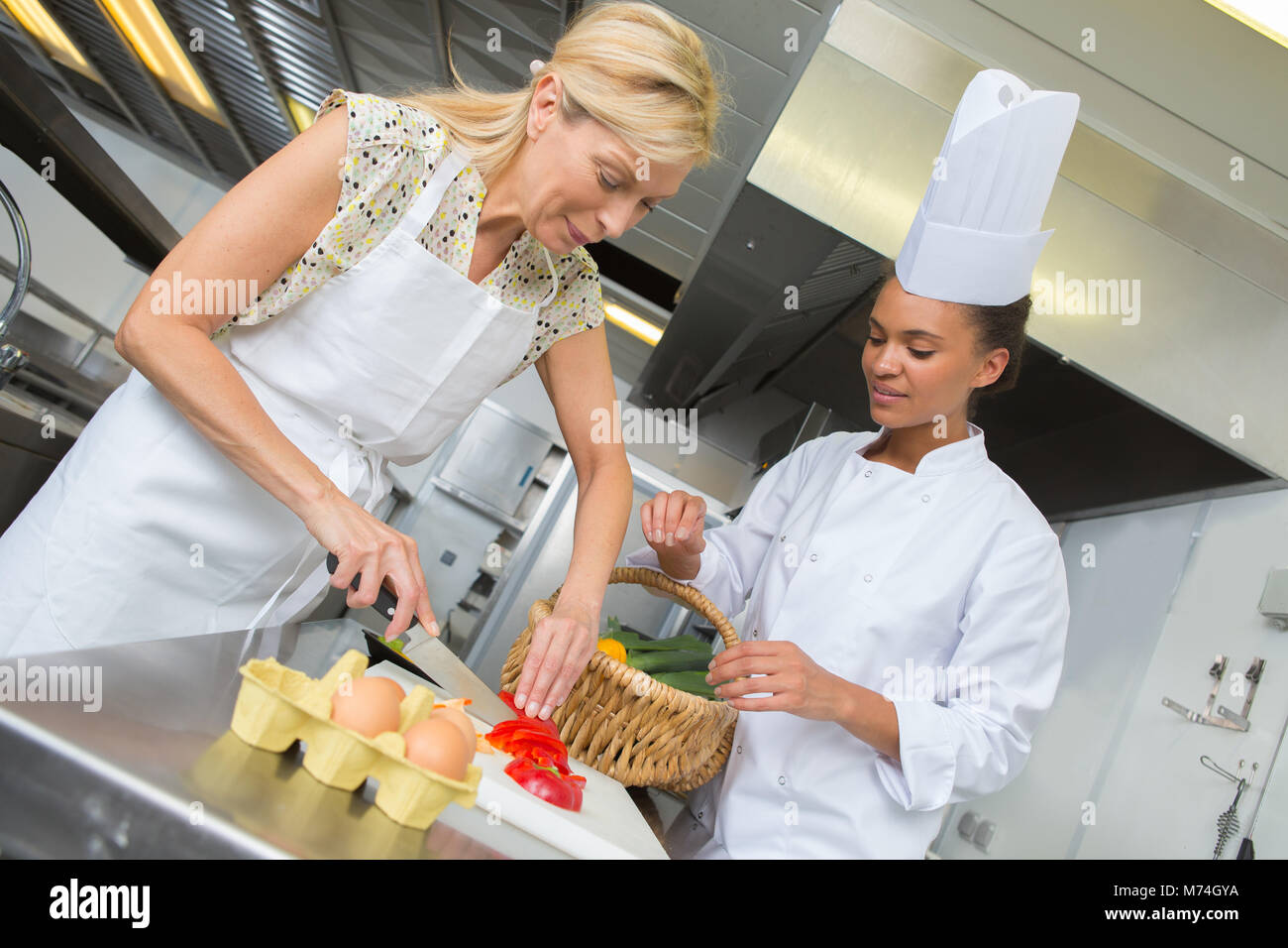 female chefs working at kitchen Stock Photo - Alamy