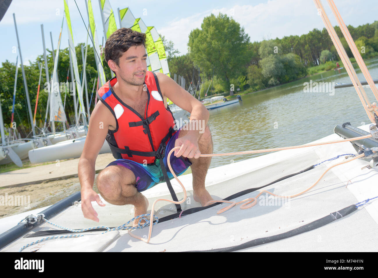 young man going sailing Stock Photo - Alamy