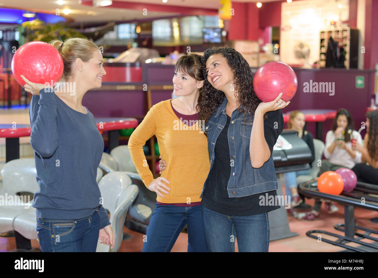 Women holding bowling balls hi-res stock photography and images - Alamy
