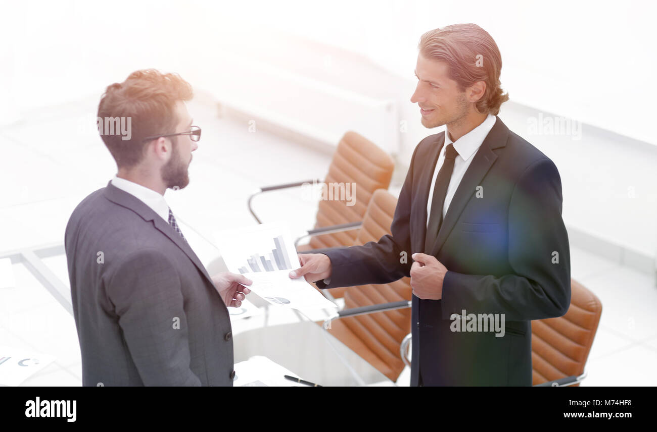 two businessmen talking in the office Stock Photo - Alamy