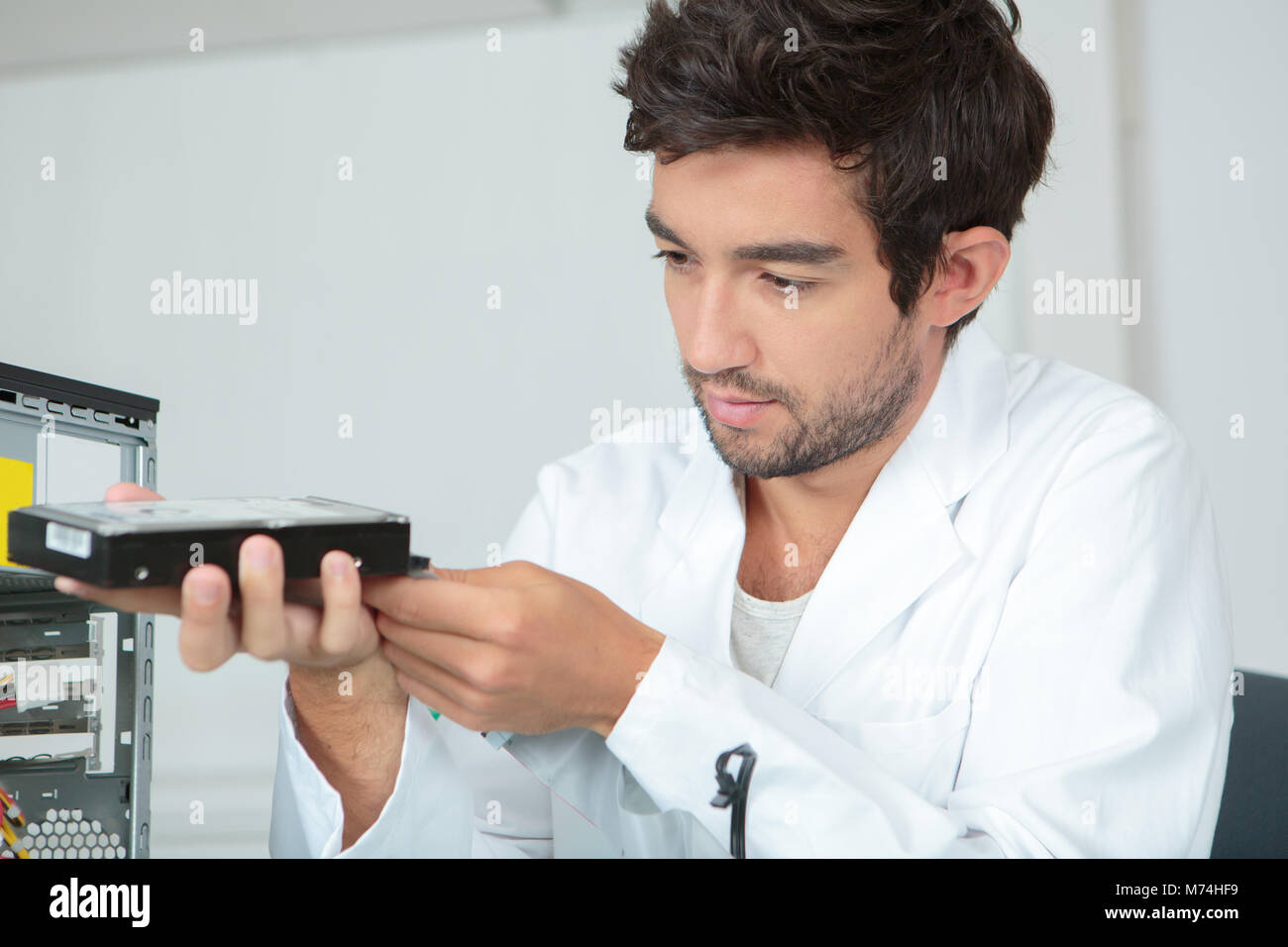 young engineer disassembling cpu double exposure Stock Photo - Alamy