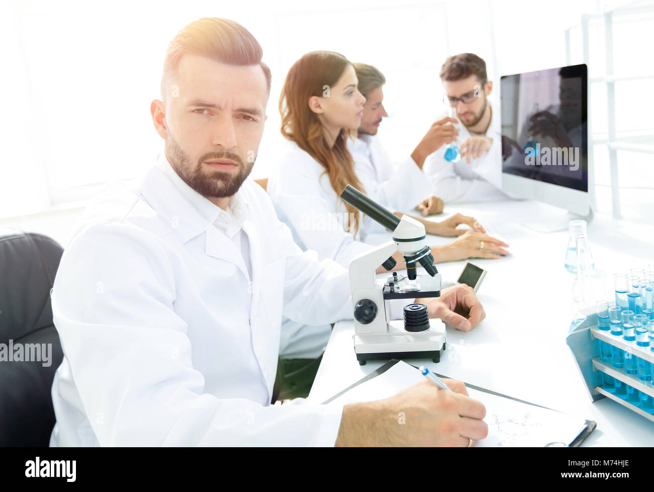 Analyzing medical data scientists working hi-res stock photography and ...