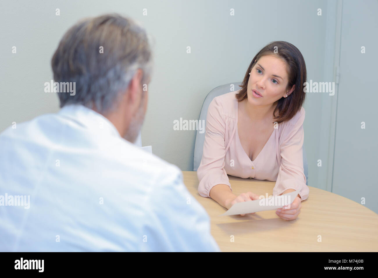 doctor and patient consultation during medical exam in hospital Stock ...