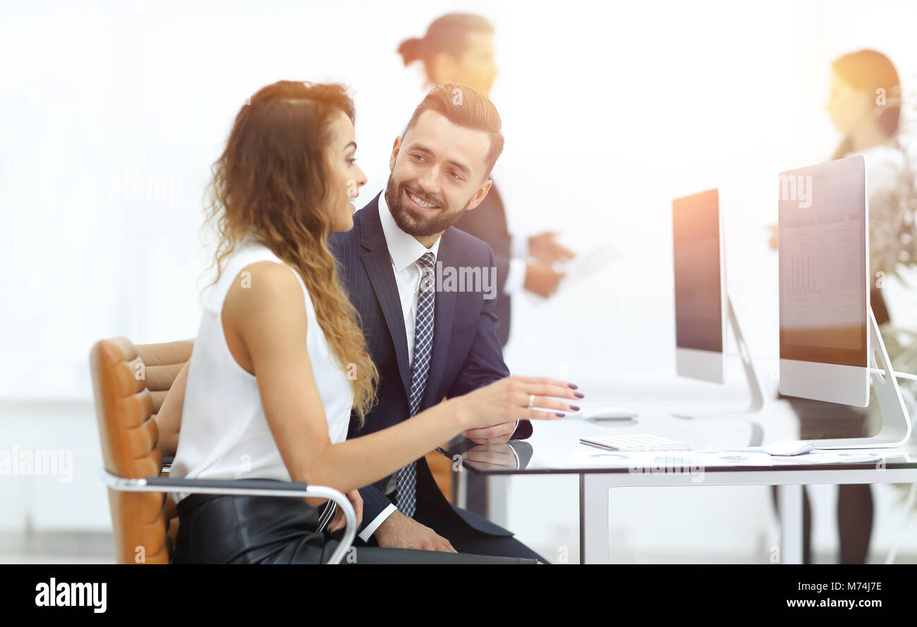 colleagues talking, sitting at your Desk Stock Photo - Alamy