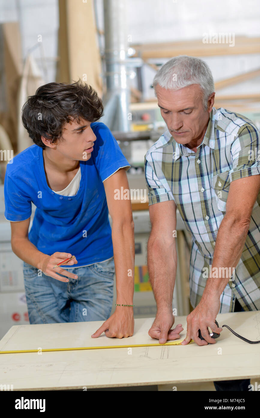 men in a workshop Stock Photo - Alamy