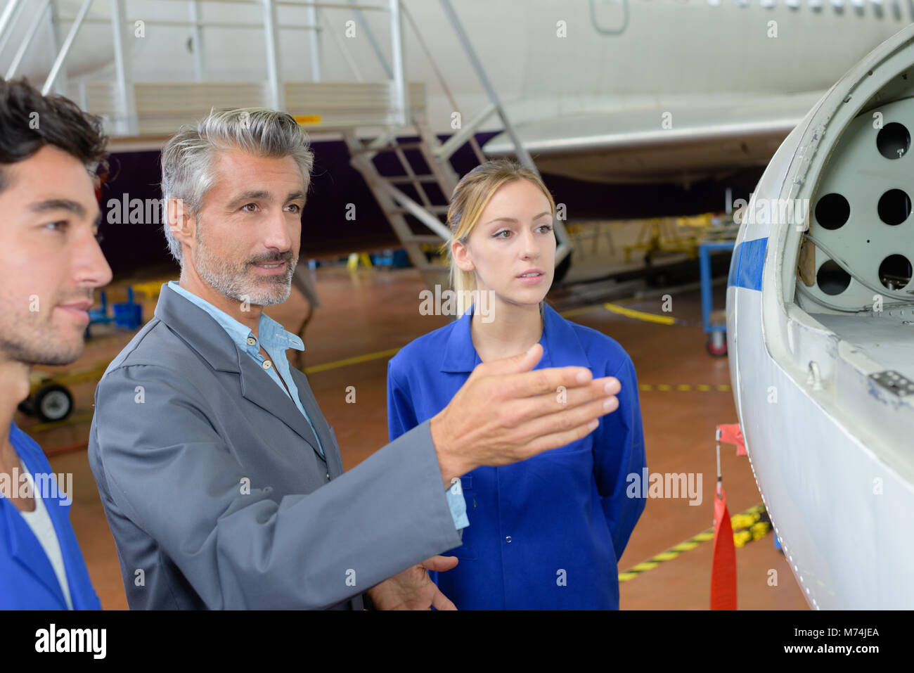 giving instruction to the apprentices Stock Photo - Alamy